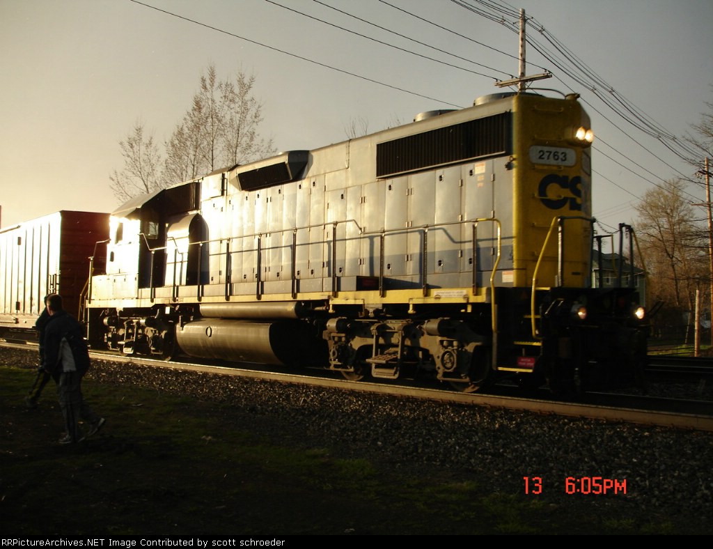 CSX 2763 (GP38-2) running long hood forward on the Shore w/ a local in tow